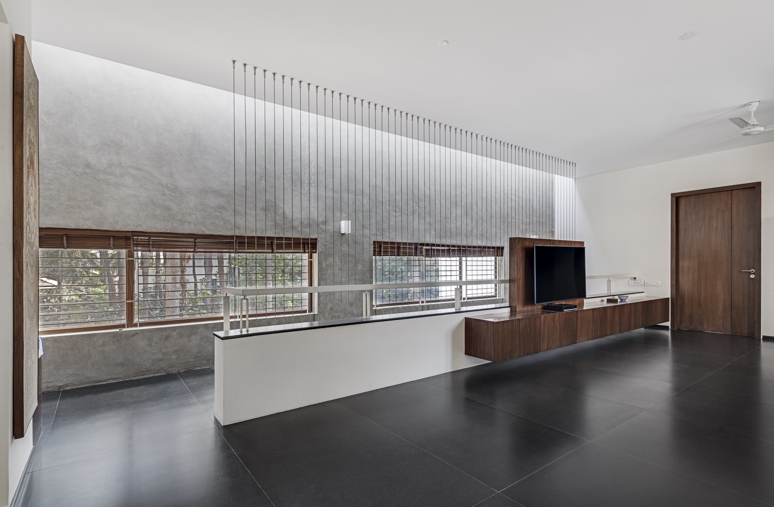 Concrete house with Vertical wood louvers