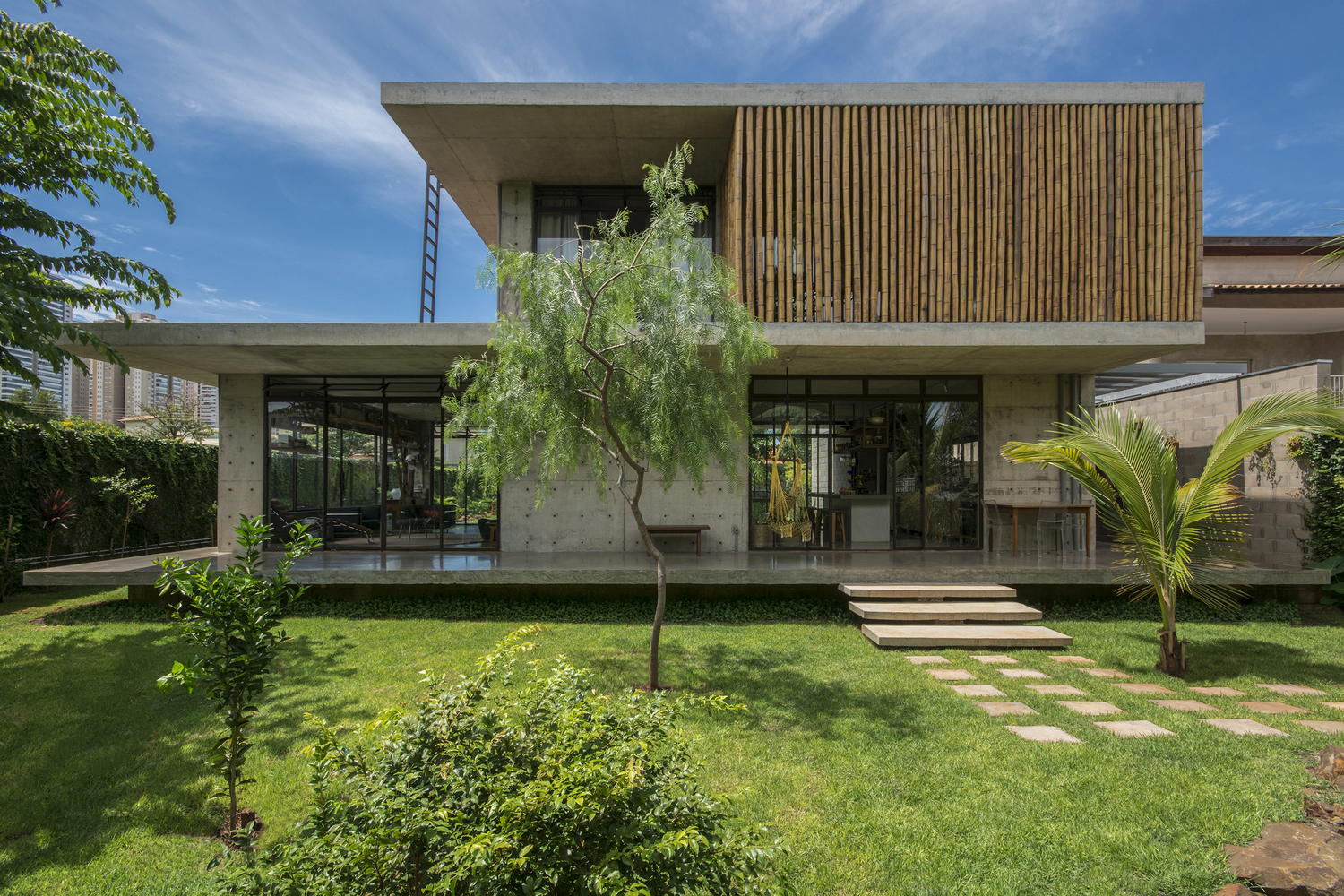 Cool concrete house with bamboo panels